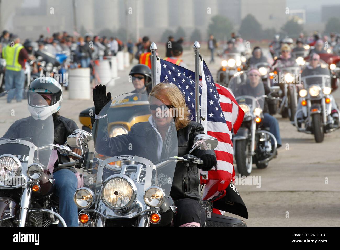 Woman ride their Harley Davidson motorcycle during a parade of the ...