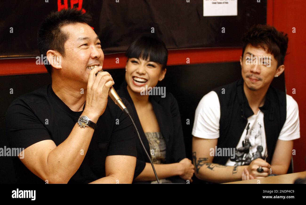 Hong Kong actor Yuan Biao, left, speaks as actress Bernice Liu, center ...