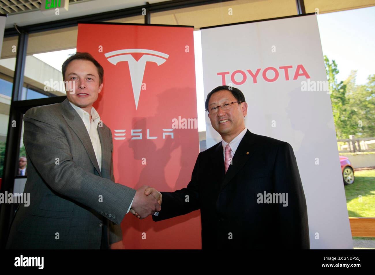 Toyota CEO Akio Toyoda, right, and Tesla CEO Elon Musk, left, at Tesla ...