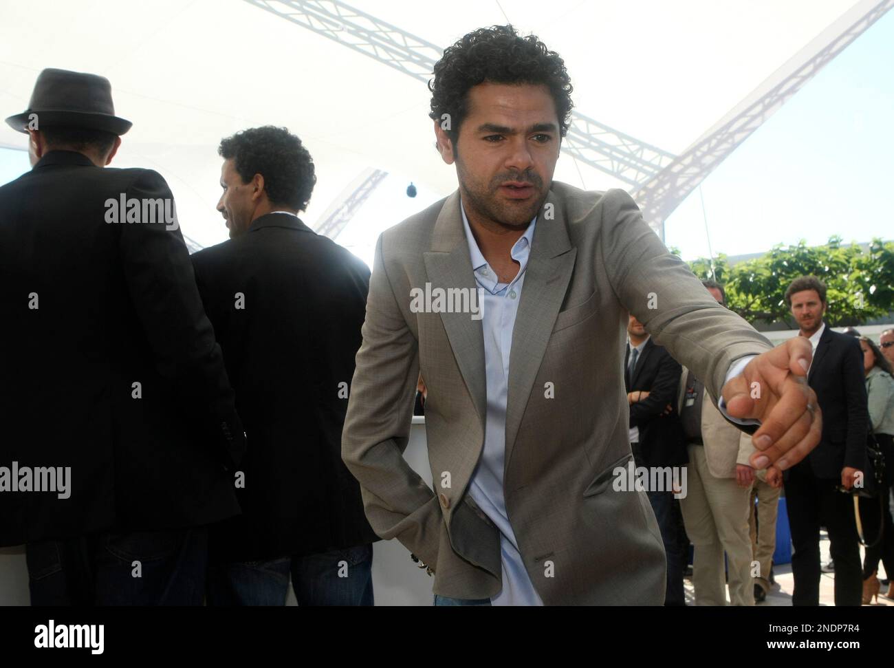 Actor Jamel Debbouze, right, goes to pick up a photographer's camera ...