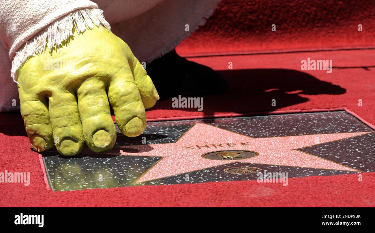 The hand of "Shrek" lays alongside his new star on the Hollywood Walk ...