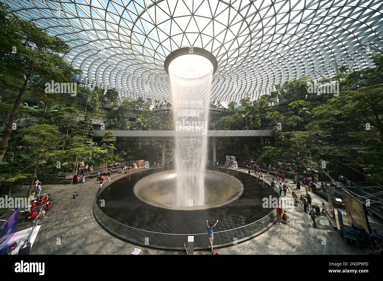 The Rain Vortex at Jewel Changi Airport, is set in a terraced tropical forest setting and ...