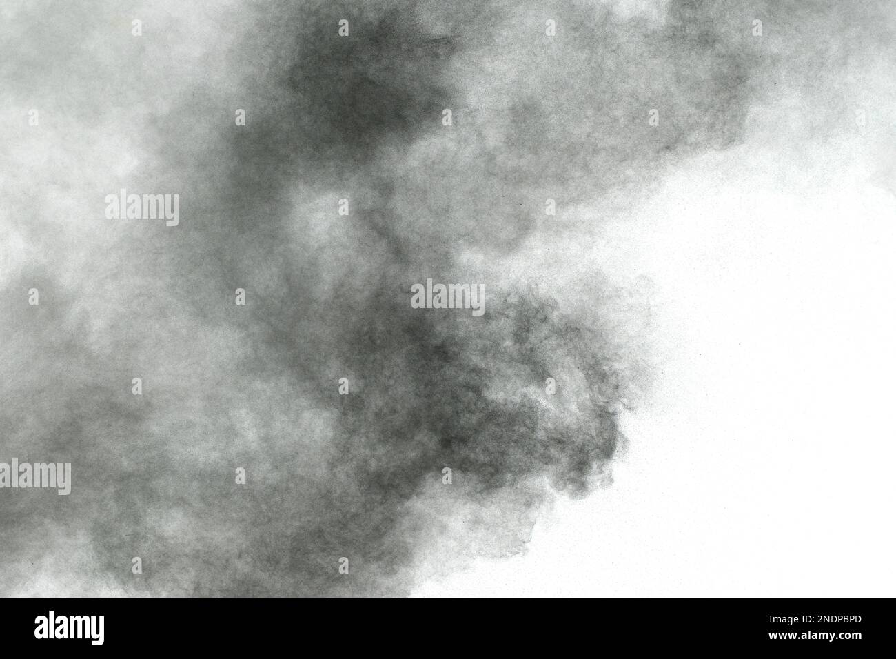 Black particles splattered on white background. Black powder dust ...