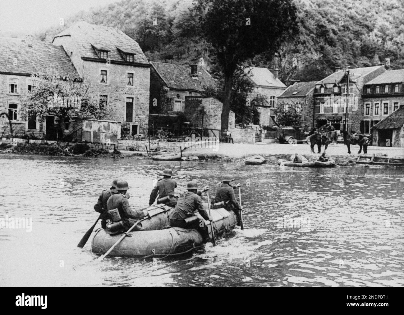 Where bridges have been blown up, German troops used rubber boats to ...