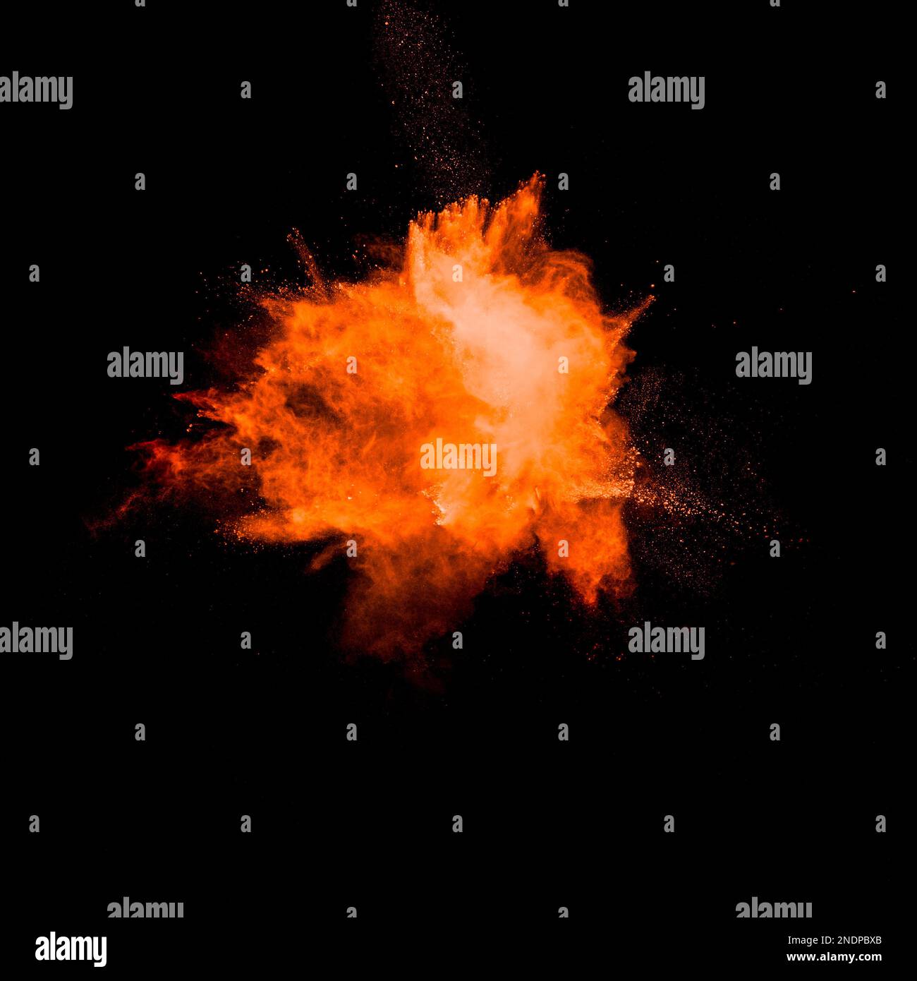 Orange powder explosion on black background. Orange color dust splash ...