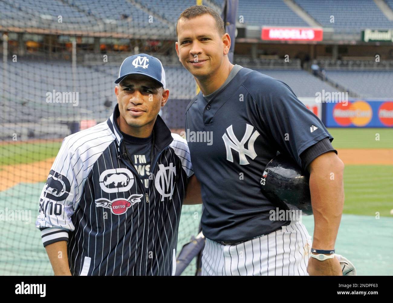 Former WBA welterweight champion Miguel Cotto, left, poses with New ...