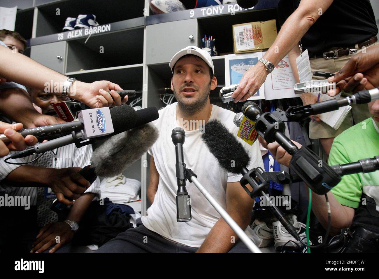 Dallas Cowboys quarterback Tony Romo (9) speaks to media in the locker ...