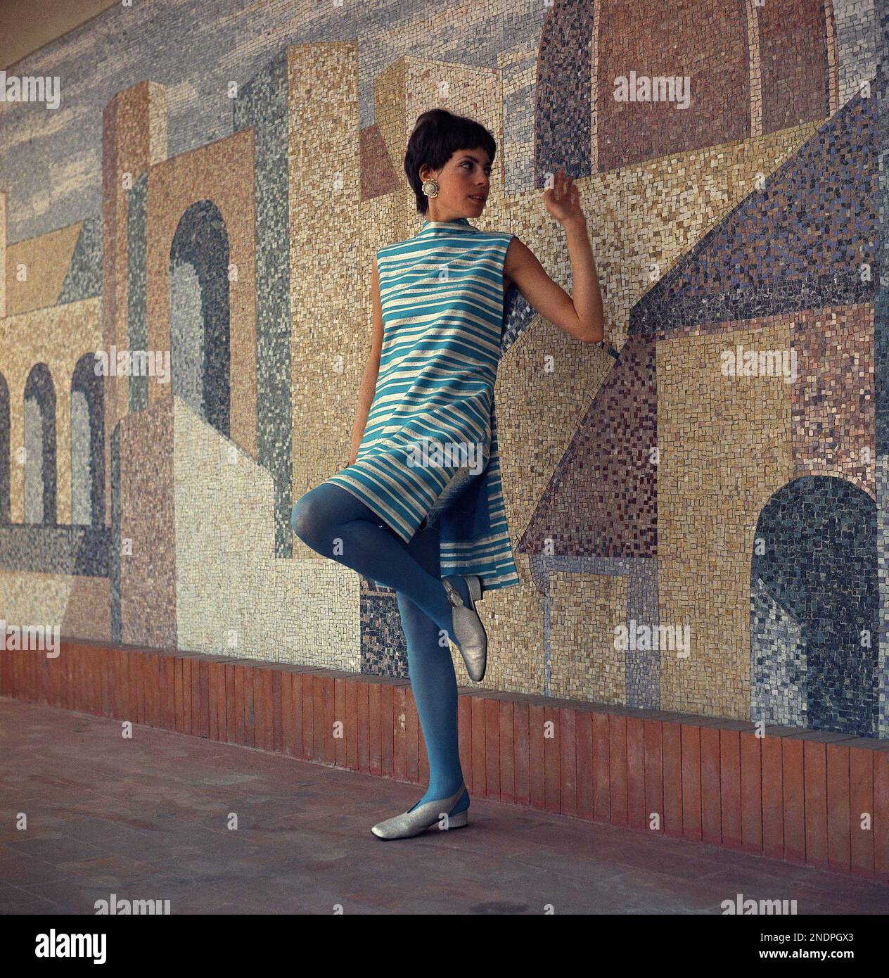 A cocktail dress of lame in turquoise, white and silver horizontal ...