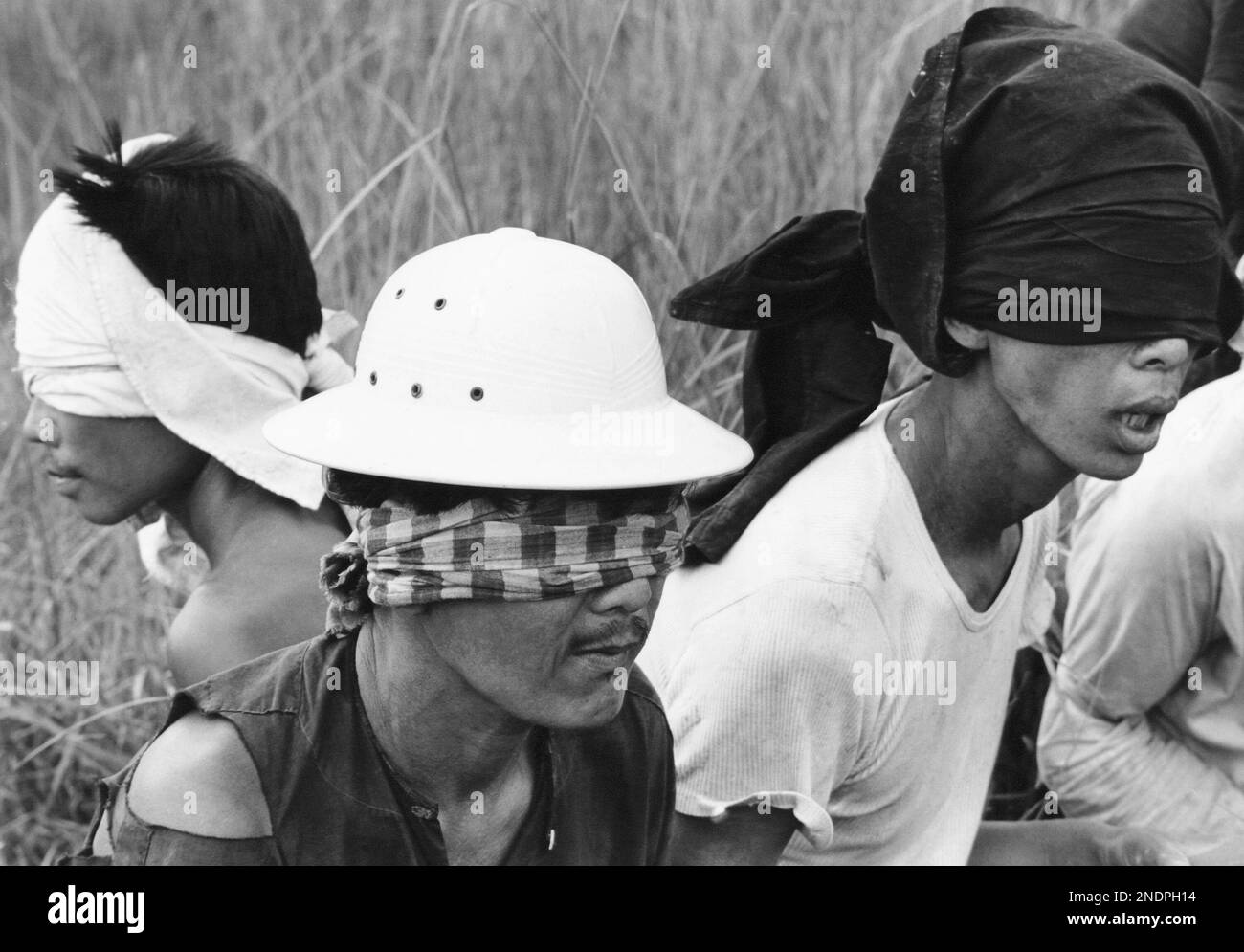 South Vietnamese rangers covered the eyes of these Viet Cong guerrillas ...