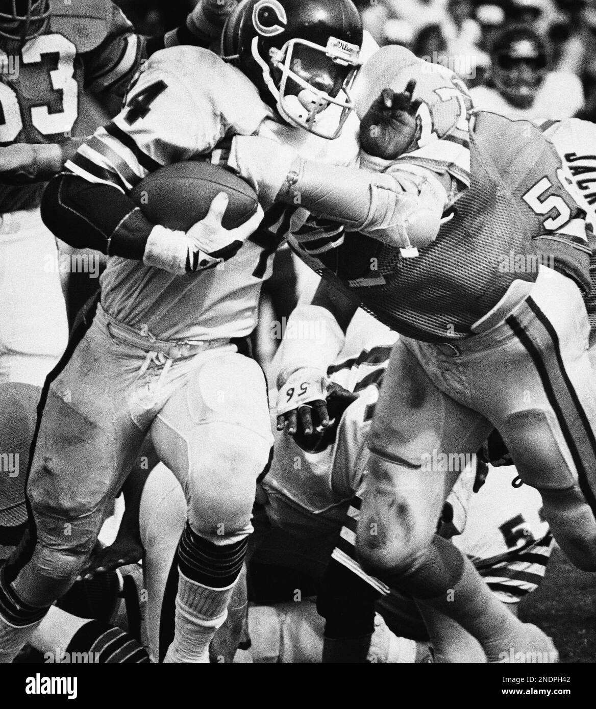 Chicago Bears running back Walter Payton is stopped after a short gain ...