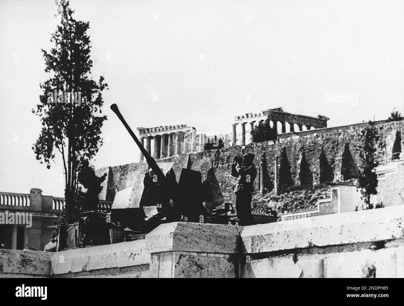 A German Anti-aircraft gun posted on the Acropolis in the city of ...