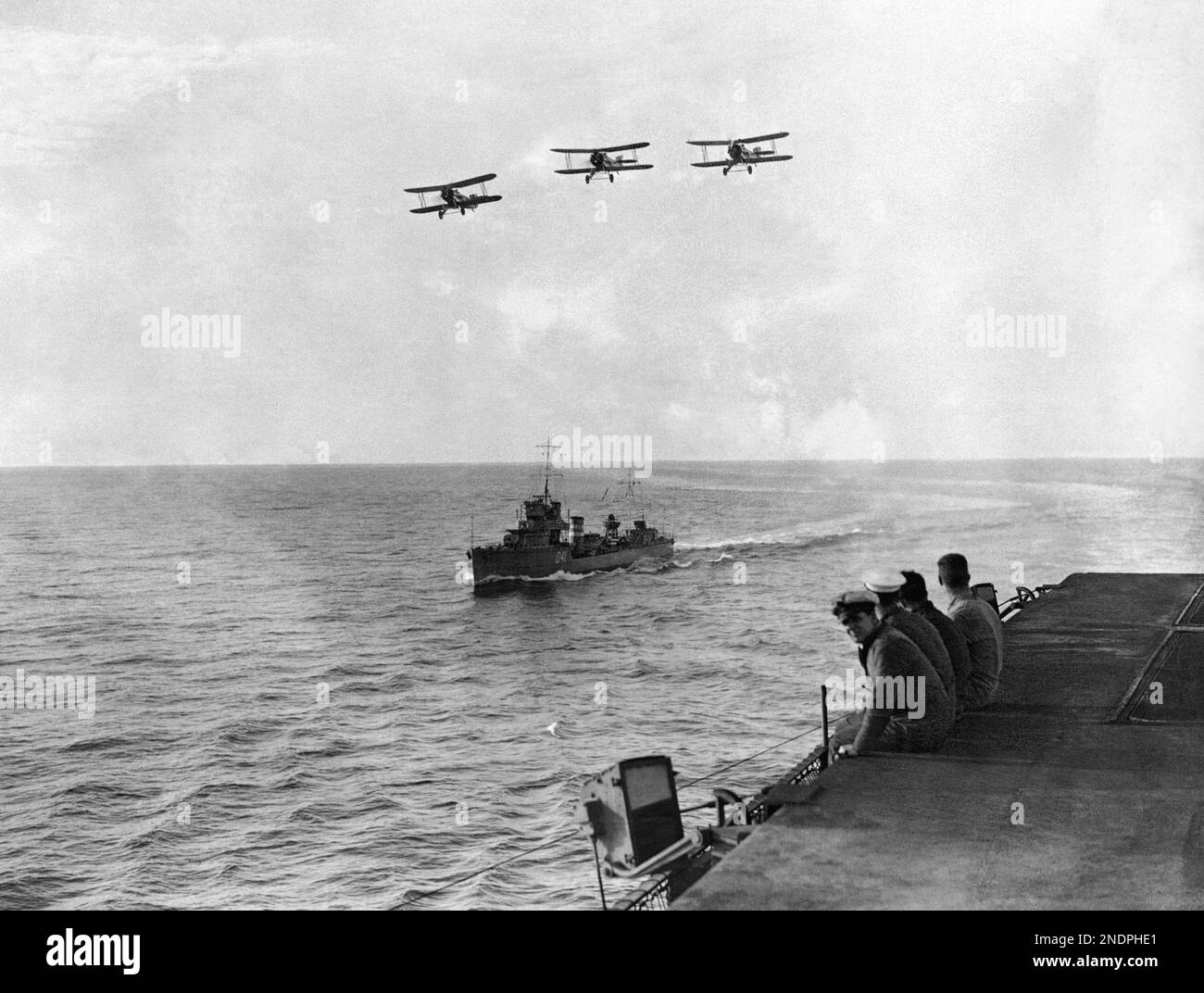 Planes flying in formation over HMS Walpole on April 11, 1933. (AP ...