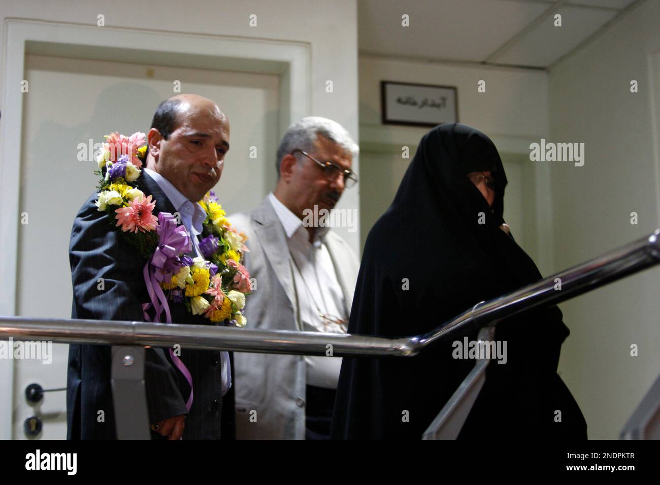 Wearing a wreath of flowers, Ali Vakili Rad, who was convicted of ...