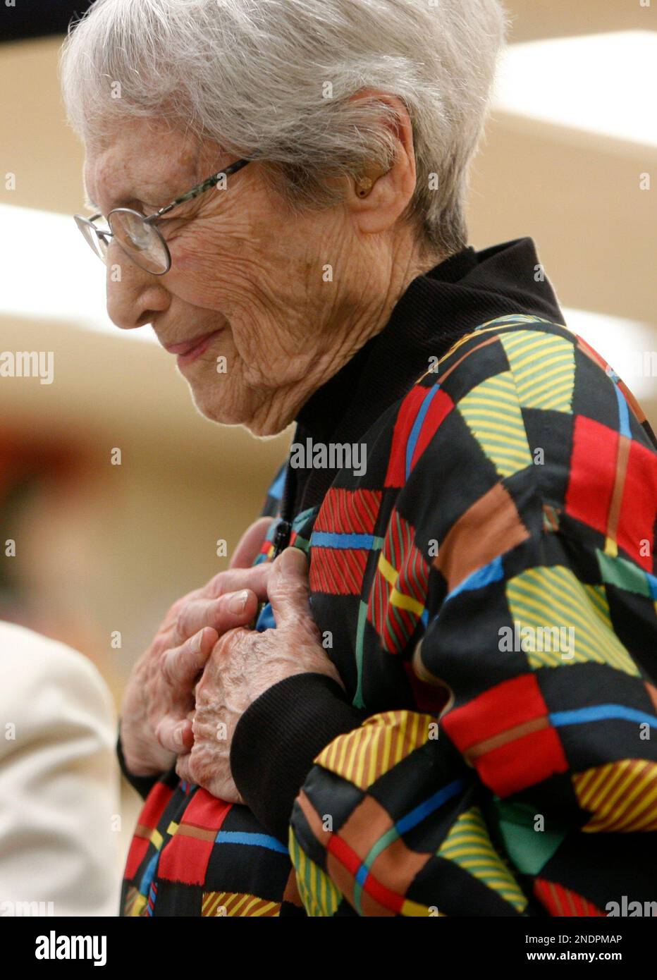 Margaret Lambert, 96, puts her hands over her heart during a ceremony ...