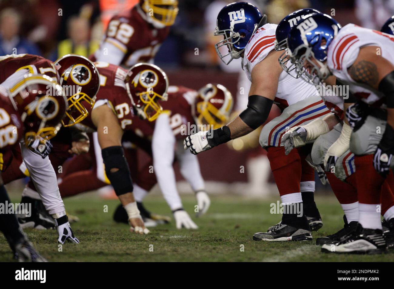 The Washington Redskins and the New York giants at the line of ...