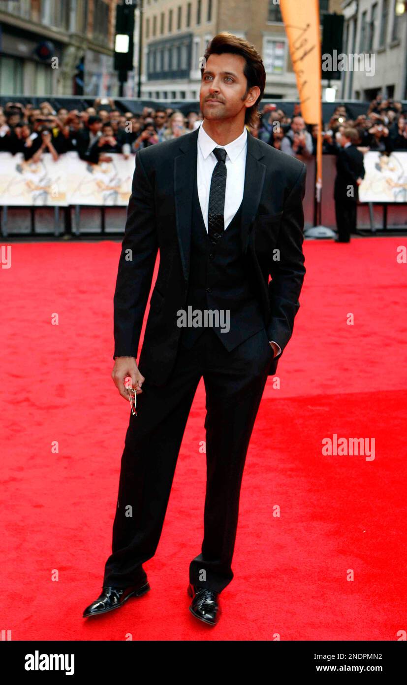 Actor Hrithik Roshan poses for the photographers as he arrives for the ...