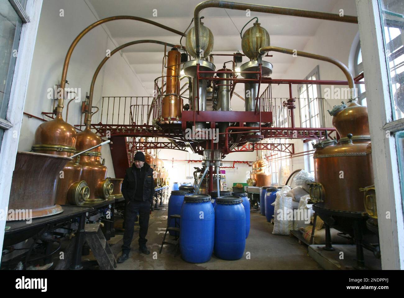 Jean-Pierre Plisson, employee of the Combier distillery, stands under ...
