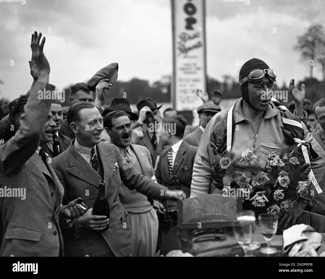 Brian Lewis wearing his winners garland after driving an Alfa Romeo to ...