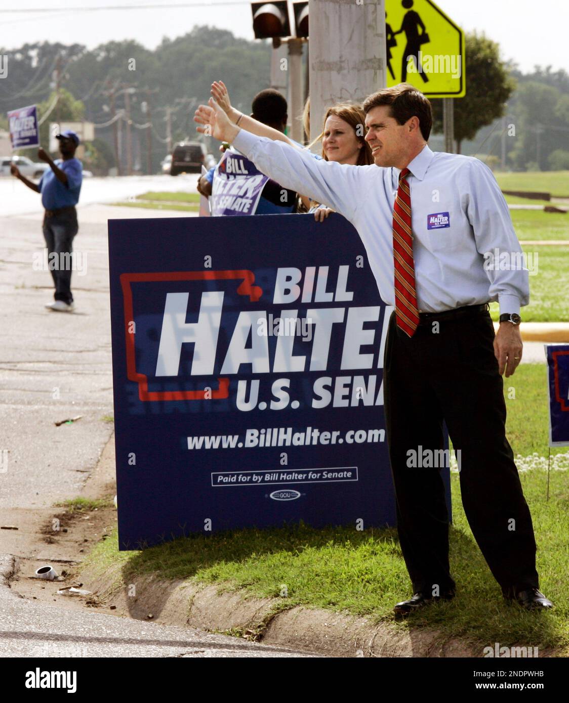 Arkansas Lt. Gov. Bill Halter waves to motorists at a West Memphis, Ark ...
