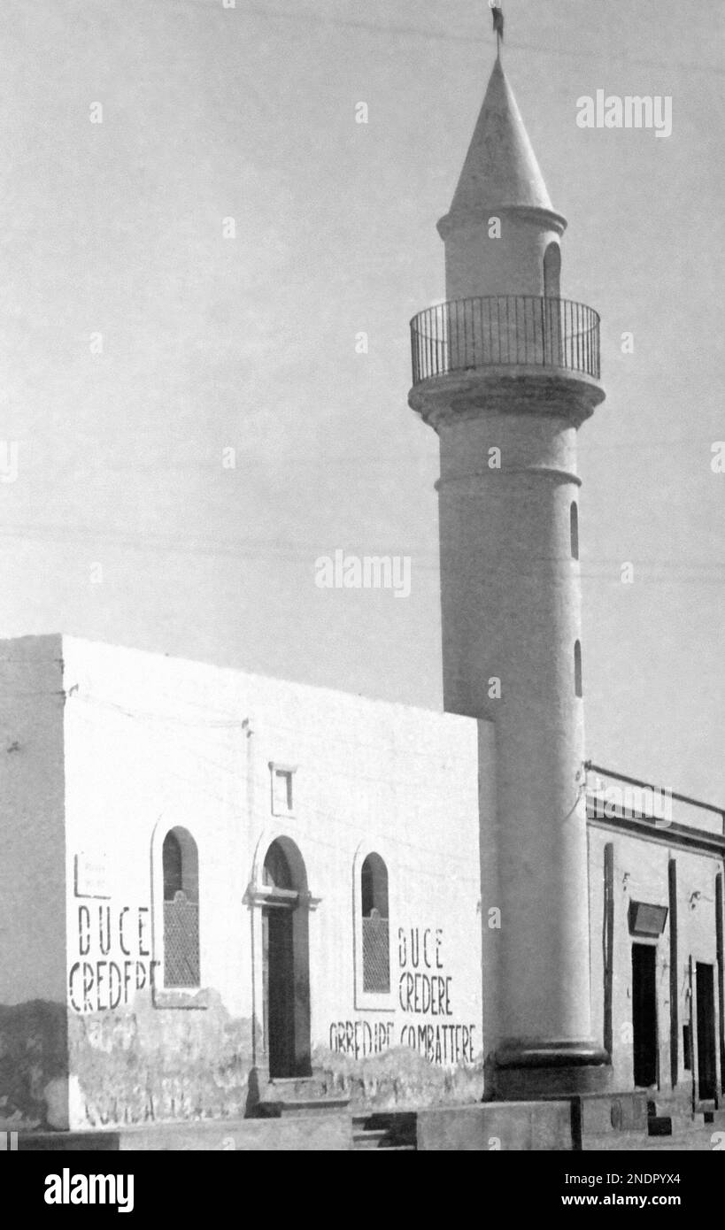 Mosque defied by Italian propaganda slogans in Libya, Feb. 28, 1941 ...