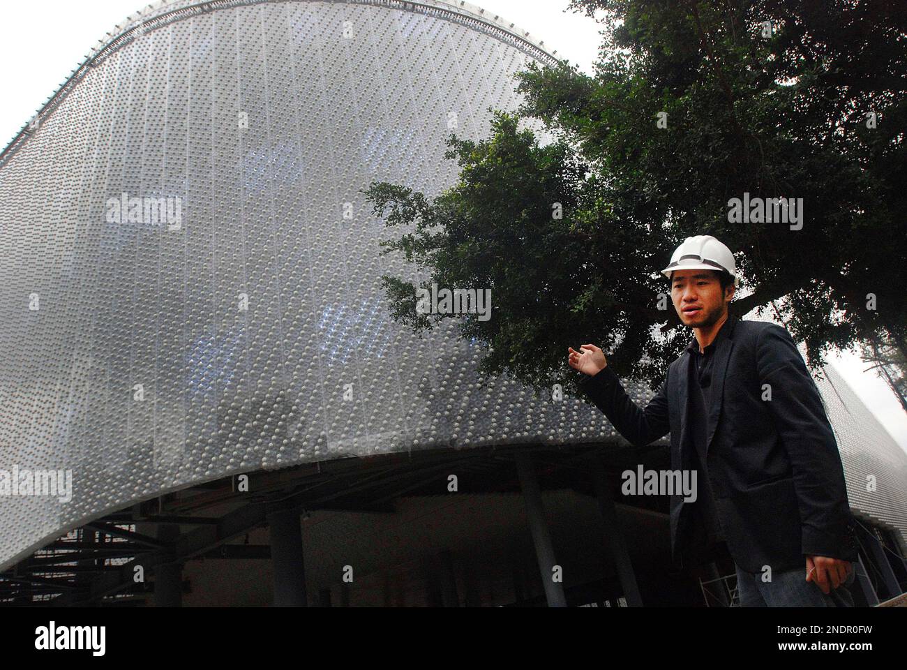 In this photo taken Tuesday, May 11, 2010, architect Arthur Huang speaks outside the main ...