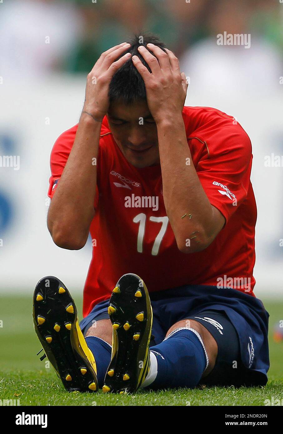 Chile's Rodrigo Millar reacts after failing a shot against Mexico ...