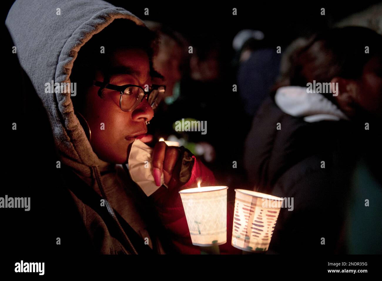 Michigan State senior Kaylee Hill, of Flint, holds a pair of candles as ...