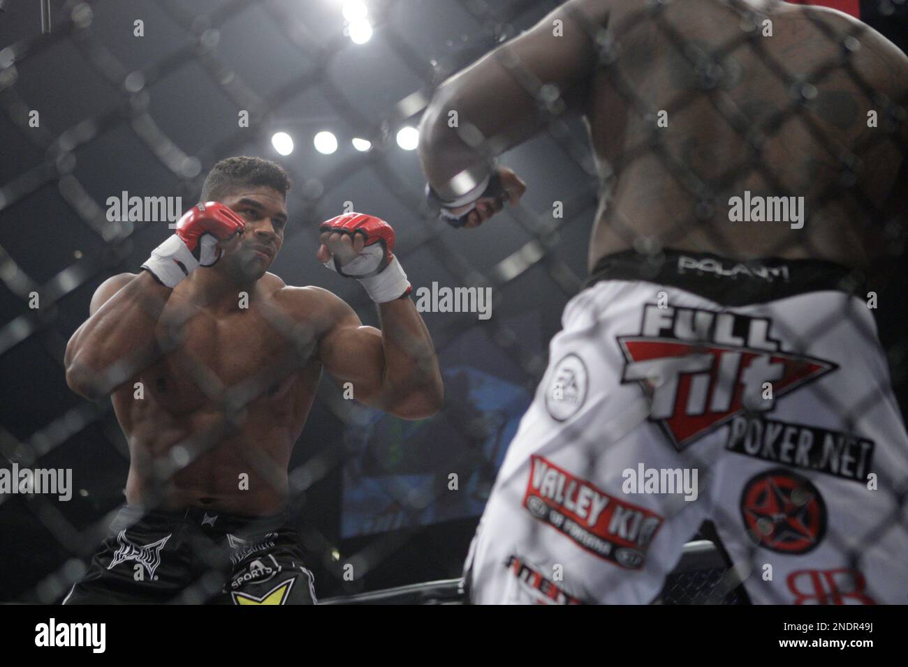 Alistair Overeem, left, fights Brett "The Grim" Rogers in a Strikeforce ...
