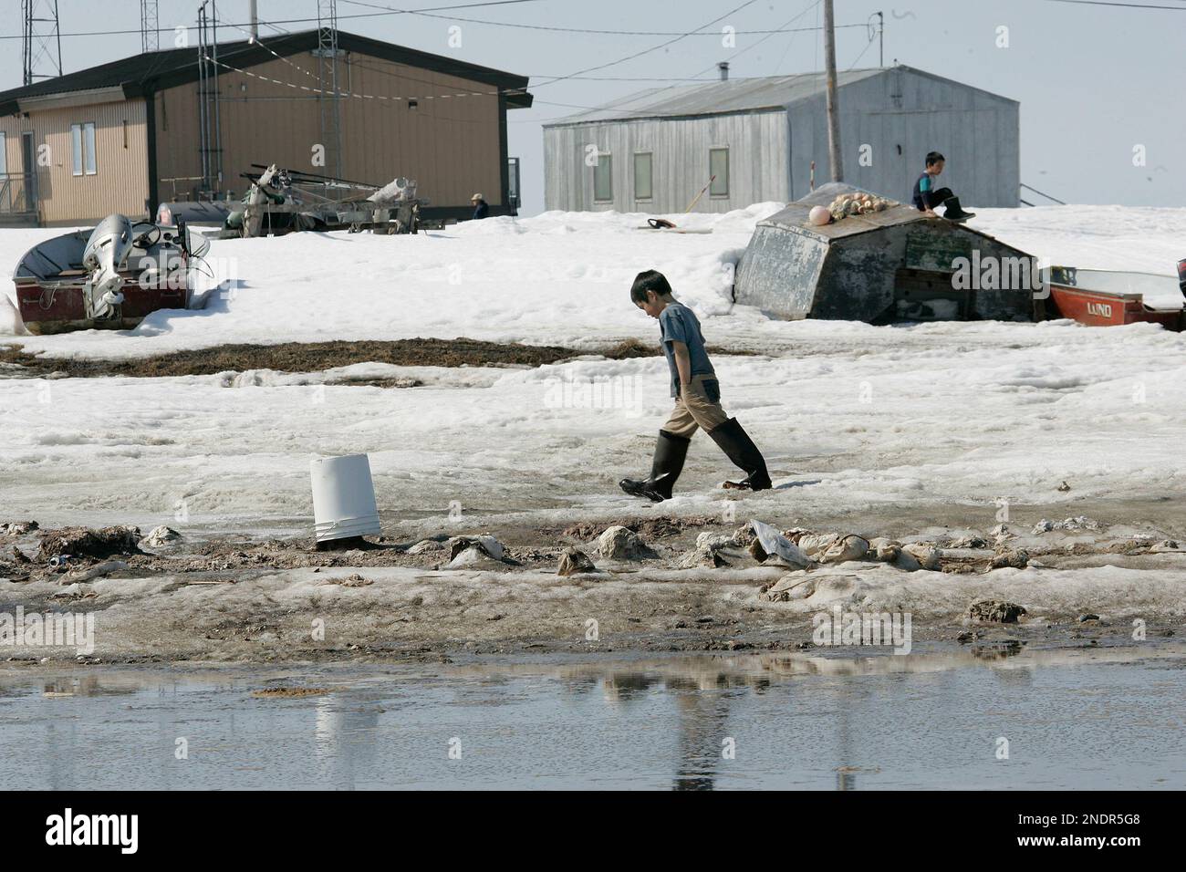 FILE - In this May 24, 2006 picture, a boy walks along the banks of the ...