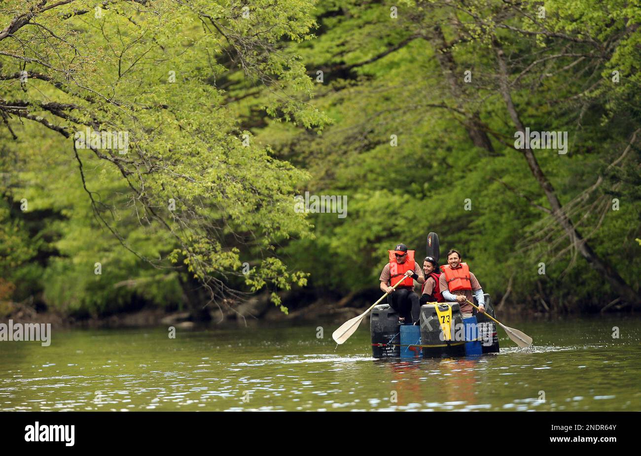 Jason Avery, left, and Tammy and Ben Kiniry head tot he finish line ...