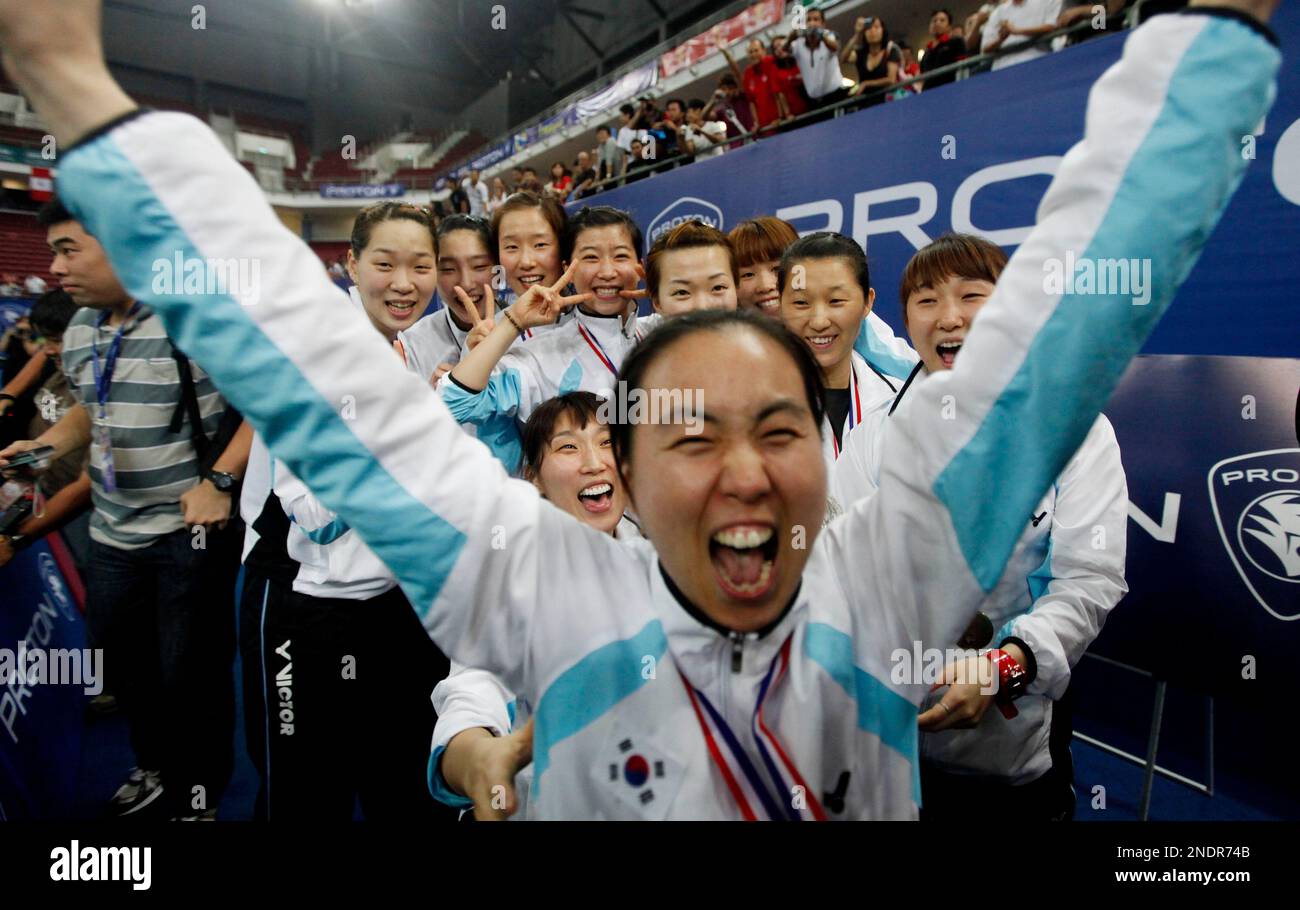 South Korea's Lee Kyung-won jumps in front of her teammates during a ...