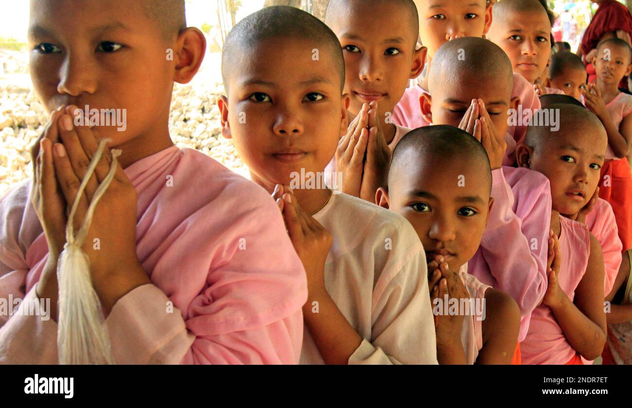 Myanmar orphans line up in monastery compound before they eat donated ...