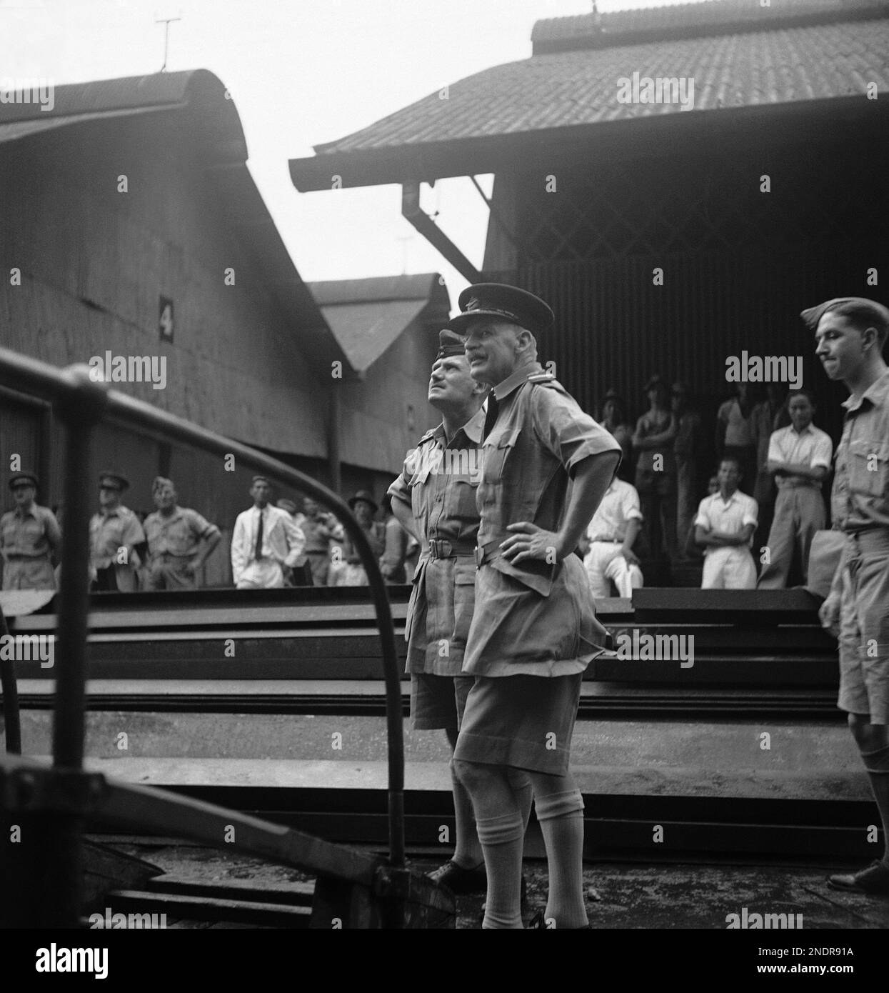 Standing authority arrival looking away uniform hi-res stock ...