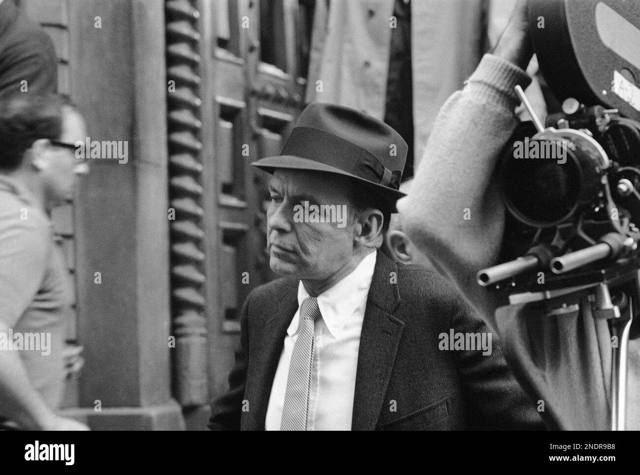 Frank Sinatra plays the title role in the film "The Detective," outside ...