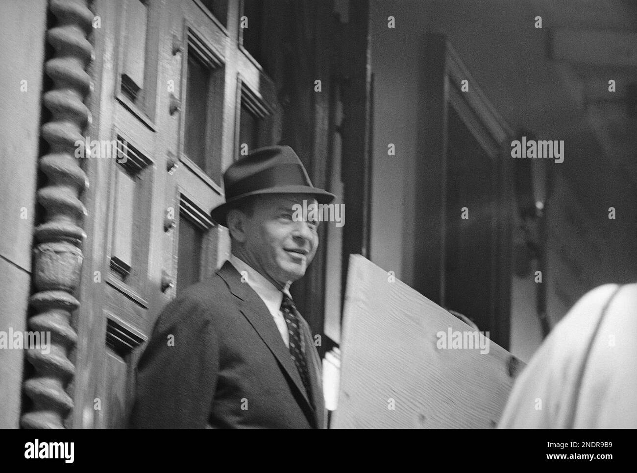 Frank Sinatra plays the title role in the film "The Detective," outside ...