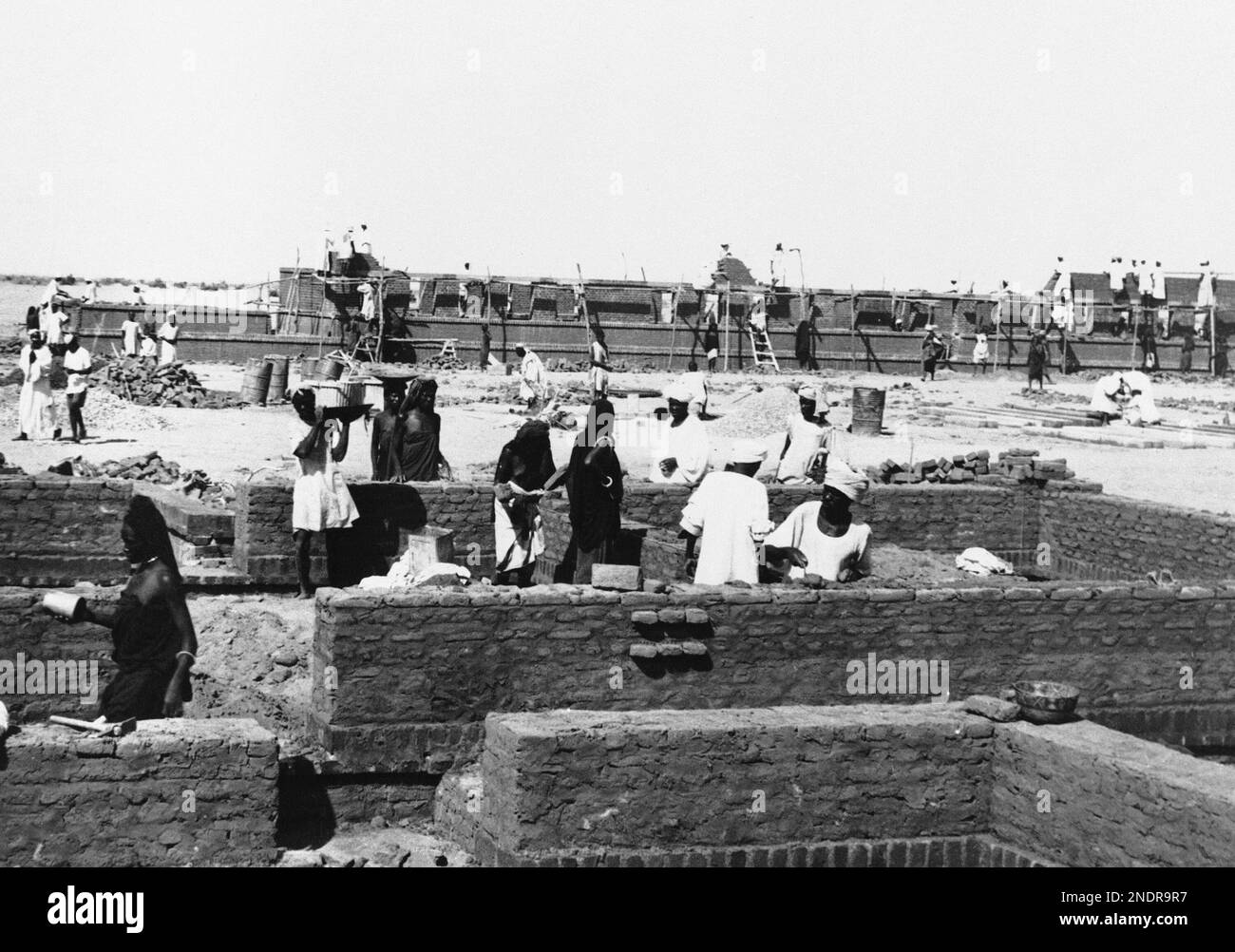 Native men from an African desert in their white robes and turbans ...
