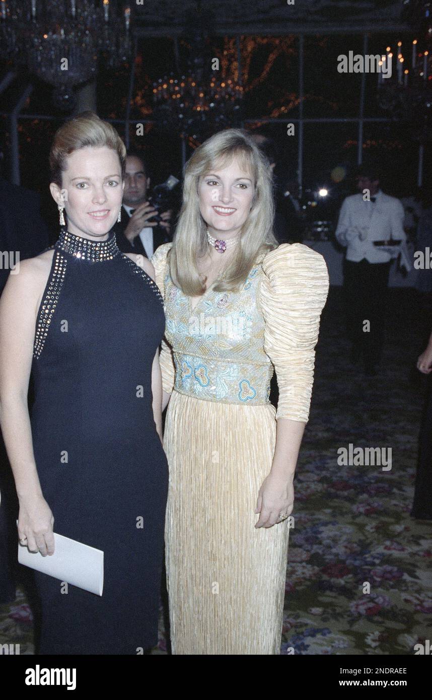 Anne Hearst, left, joined by her sister Patty Hearst-Shaw, right, pose ...