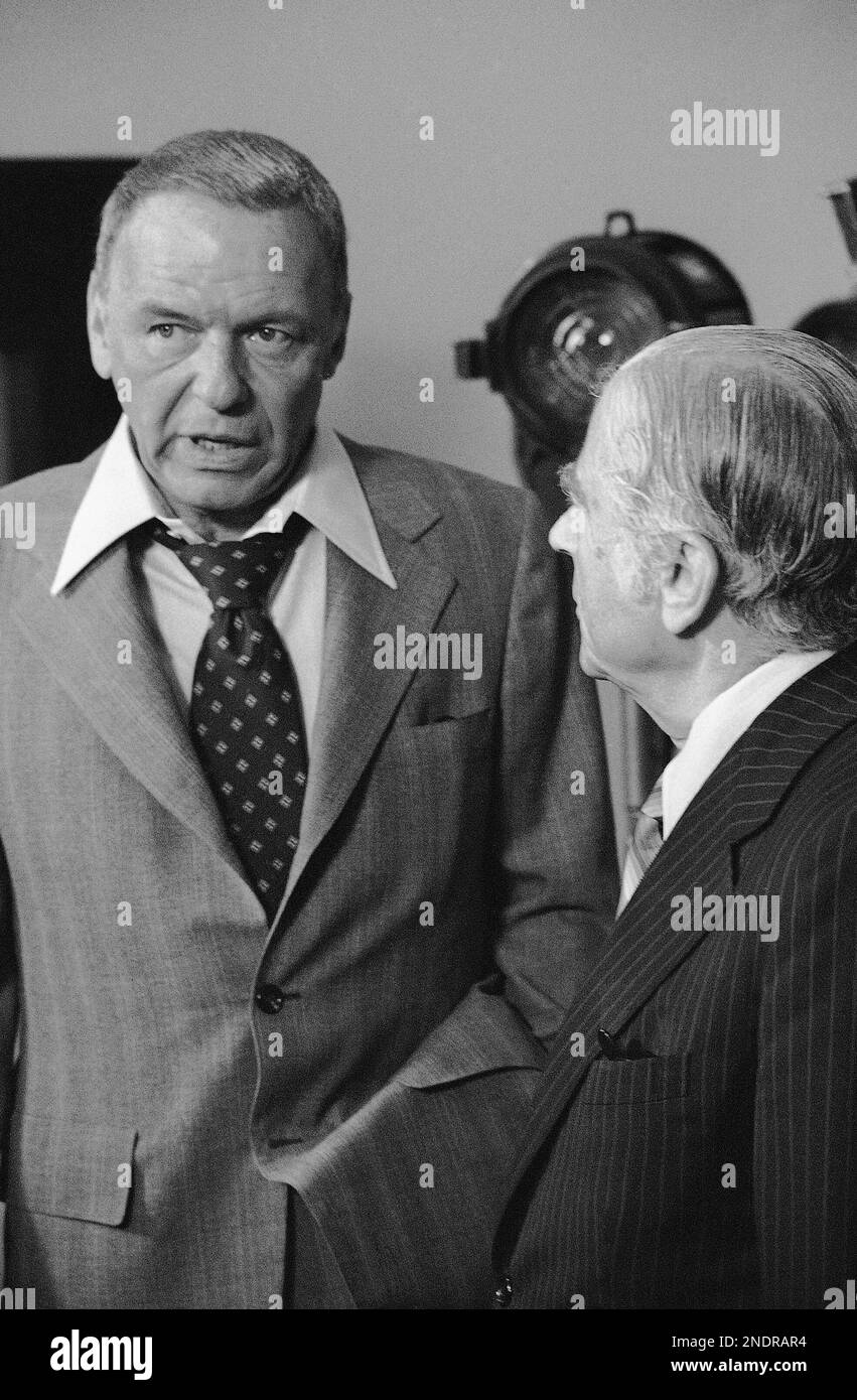 Frank Sinatra, left, and New York City Mayor Abraham Beame chat on the ...