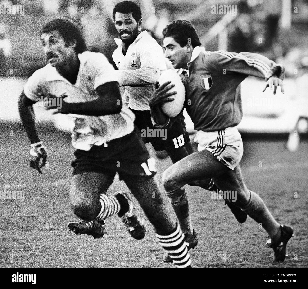 Italian fullback Daniele Tebaldi, right, steps between Fijian defenders ...