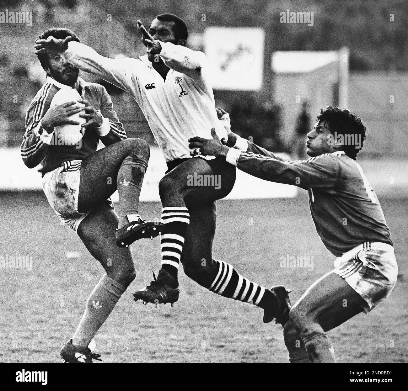 Italian winger Massimo Mascioletti, left, catches the ball as Fijian ...