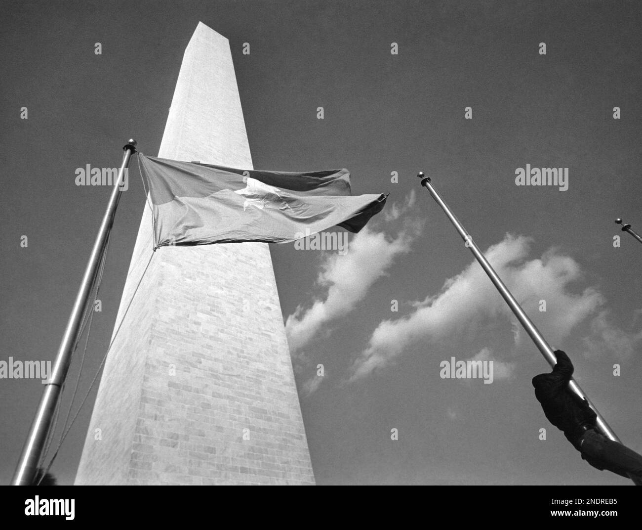 The flag of the Viet Cong flies from the pole at the base of the ...