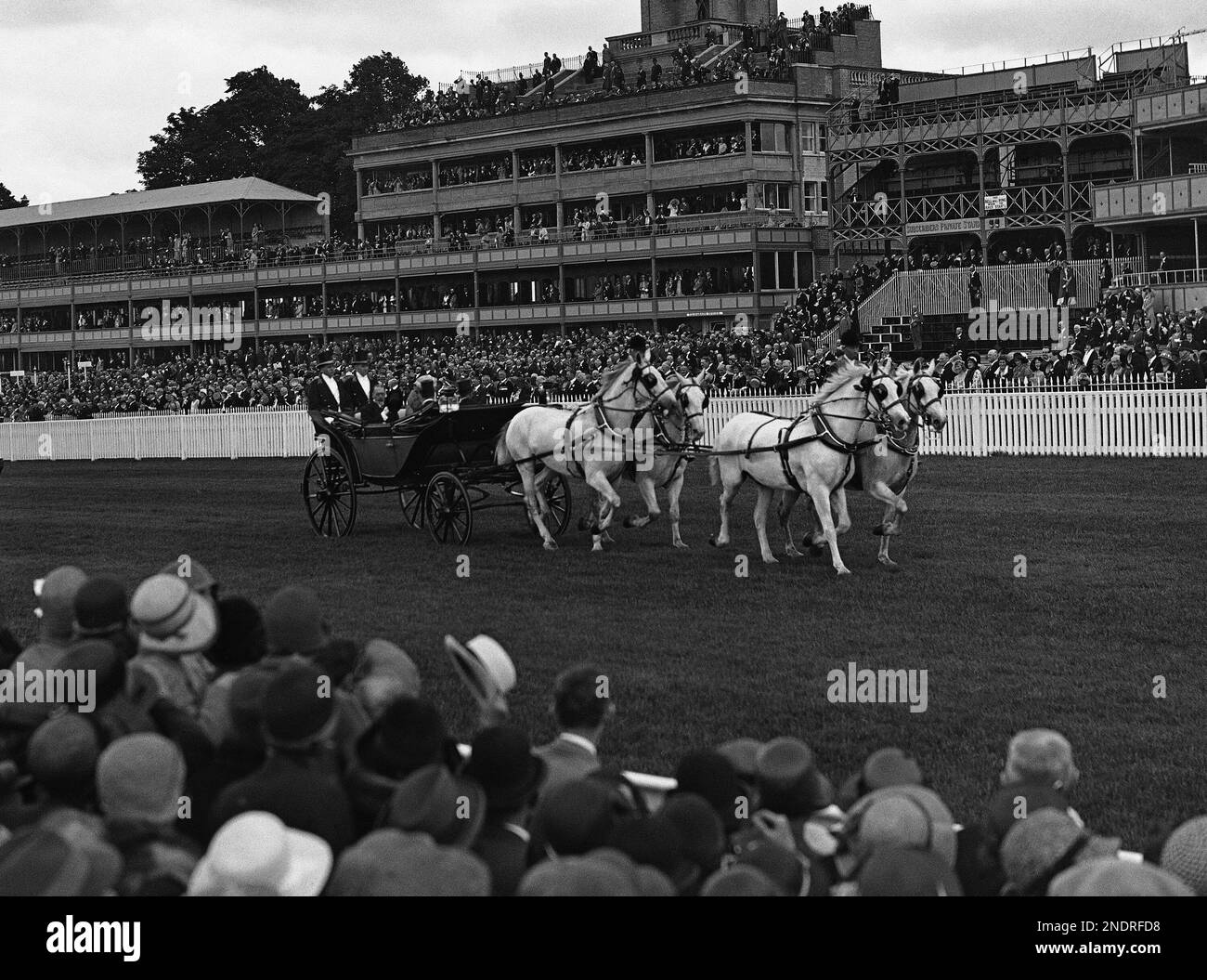 The Royal carriage driving up the course on arrival at Ascot Racecourse ...