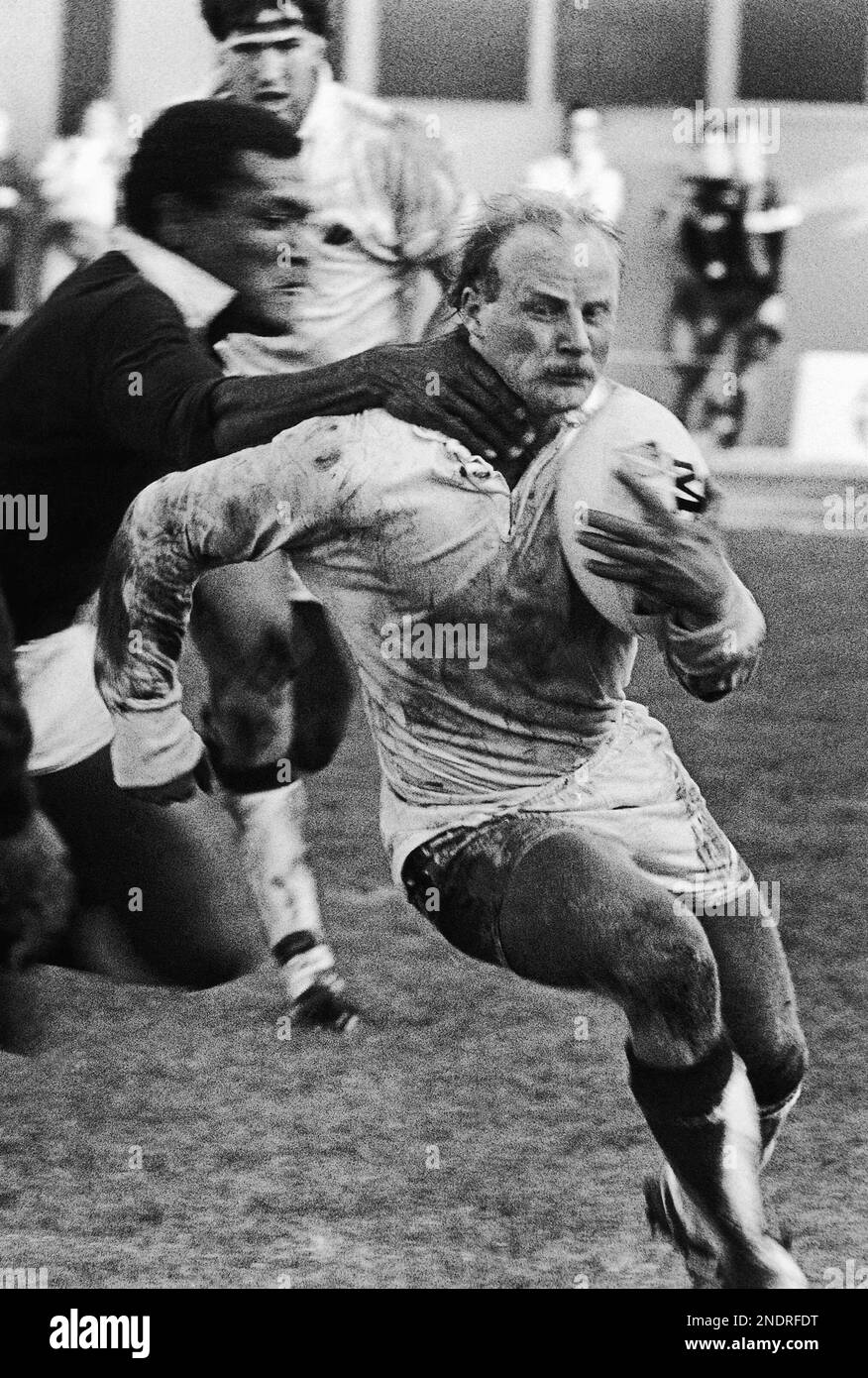 Canada’s half back Ian Stuart is grabbed around the throat by Tonga's ...