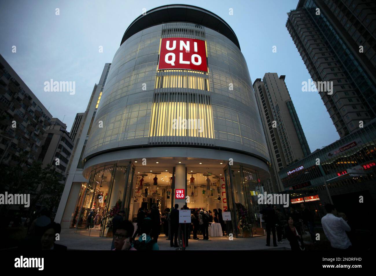 People gather for the pre-opening event of the largest global flagship ...