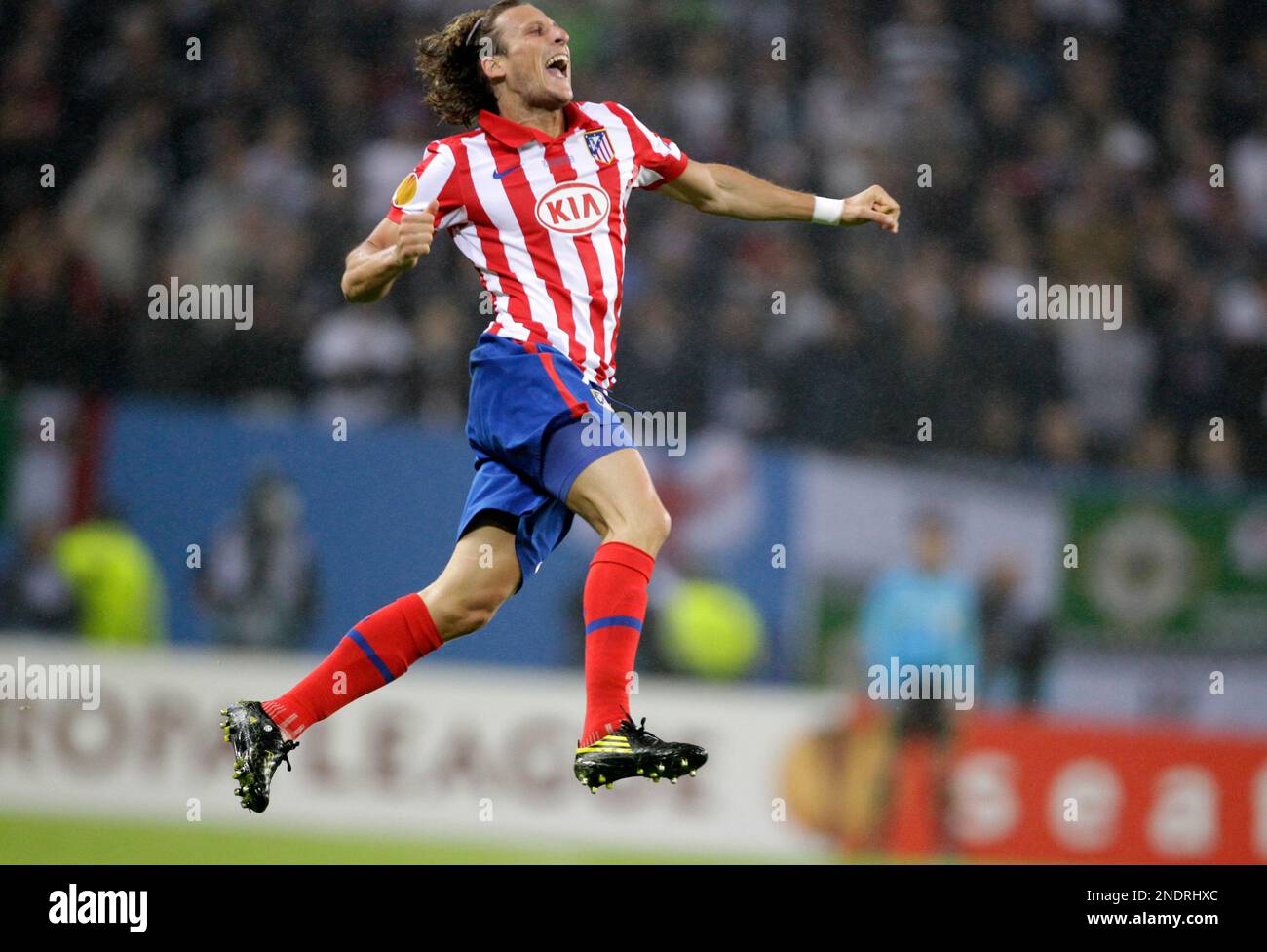 Atletico's Diego Forlan celebrates scoring his side's first goal during ...
