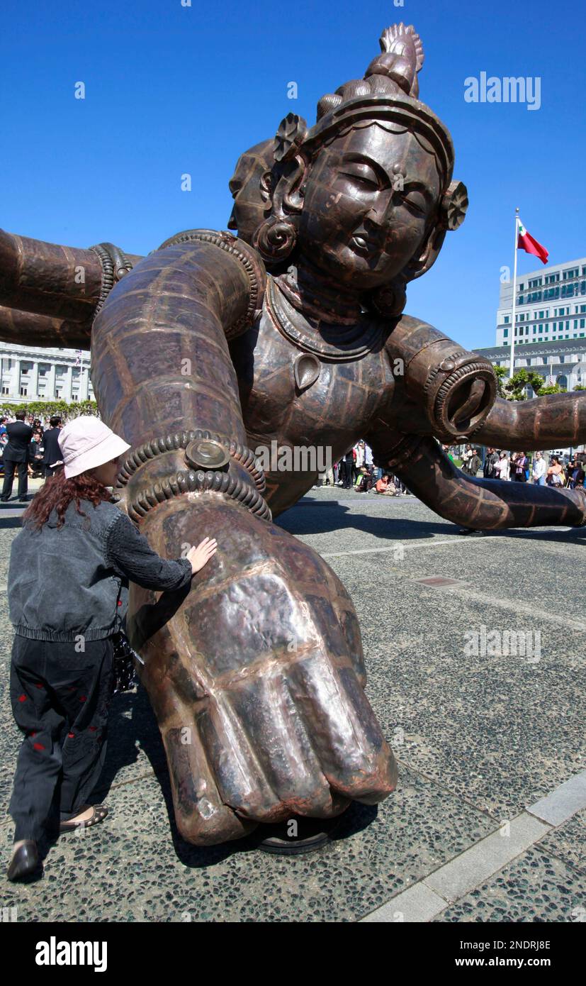 A huge bronze sculpture by Shanghai artist Zhang Huan entitled "Three ...