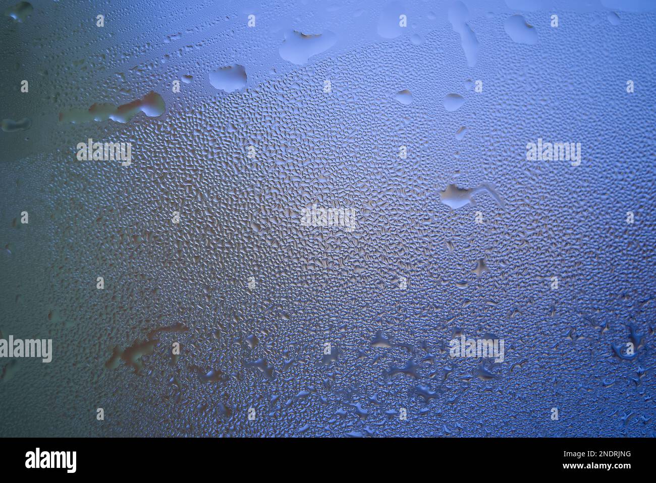 Water droplets or condensation on the outside of a cold windows in a ...