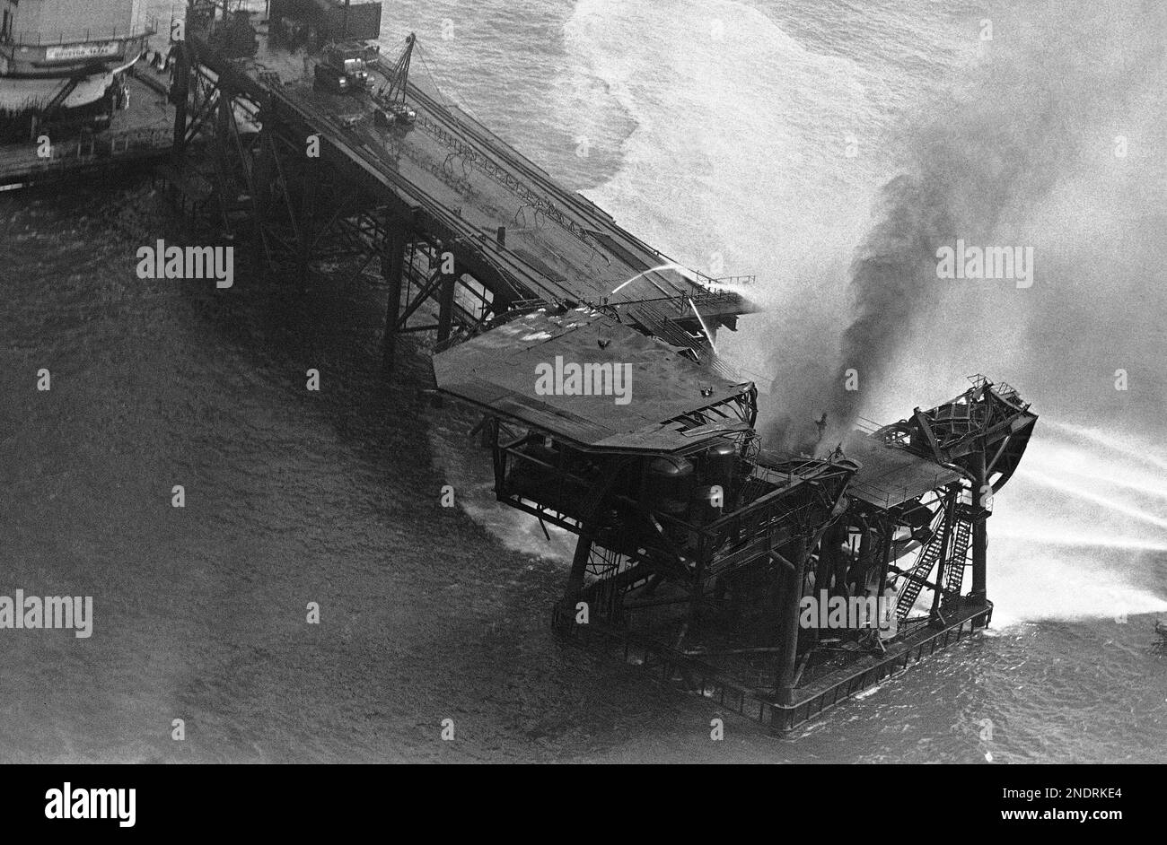 Oil spews a hundred feet into the air as an offshore rig blows wild in ...