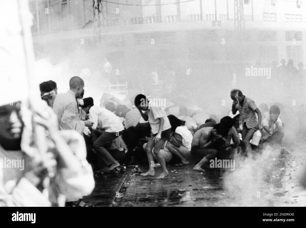 Buddhist monks and demonstrators run in panic as tear gas serenades ...