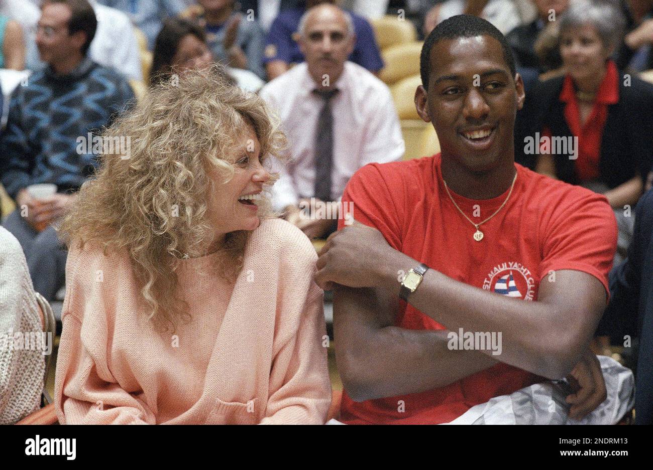 Actress Dyan Cannon smiles as she sits with Kansas All-American Danny ...